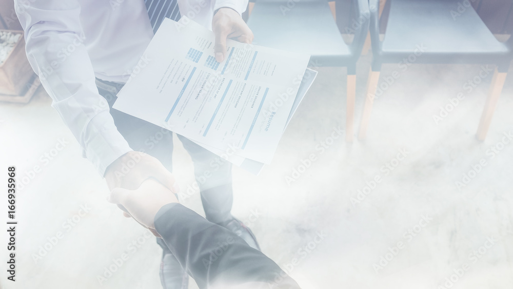 Blurred image, Business man handshake and paperwork pose conveying job ...