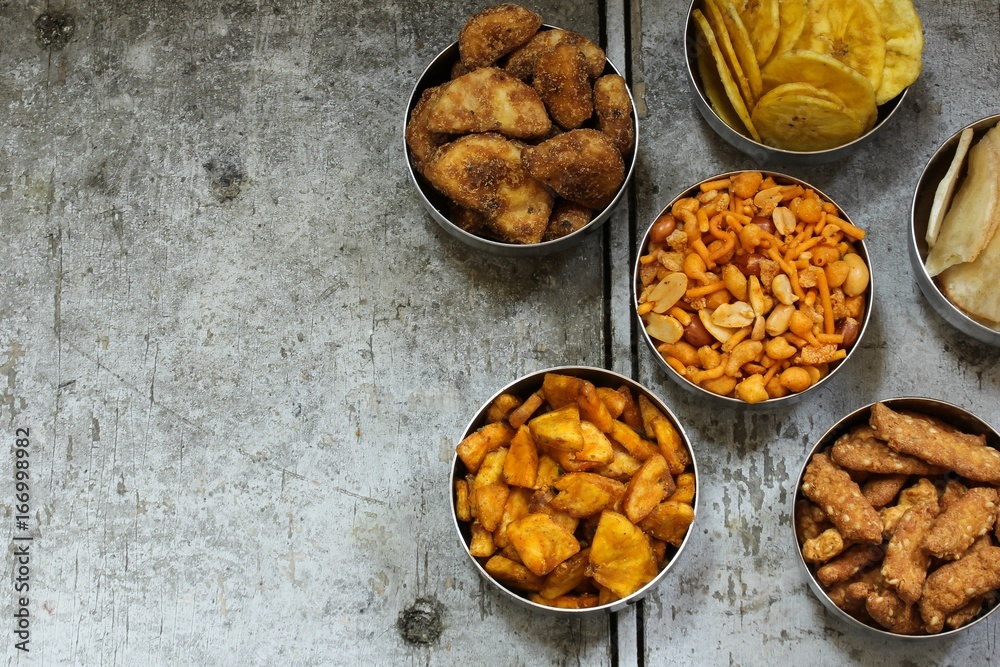 Variety of Indian snacks - Mixture, Tapiyoca chips, banana chips ...