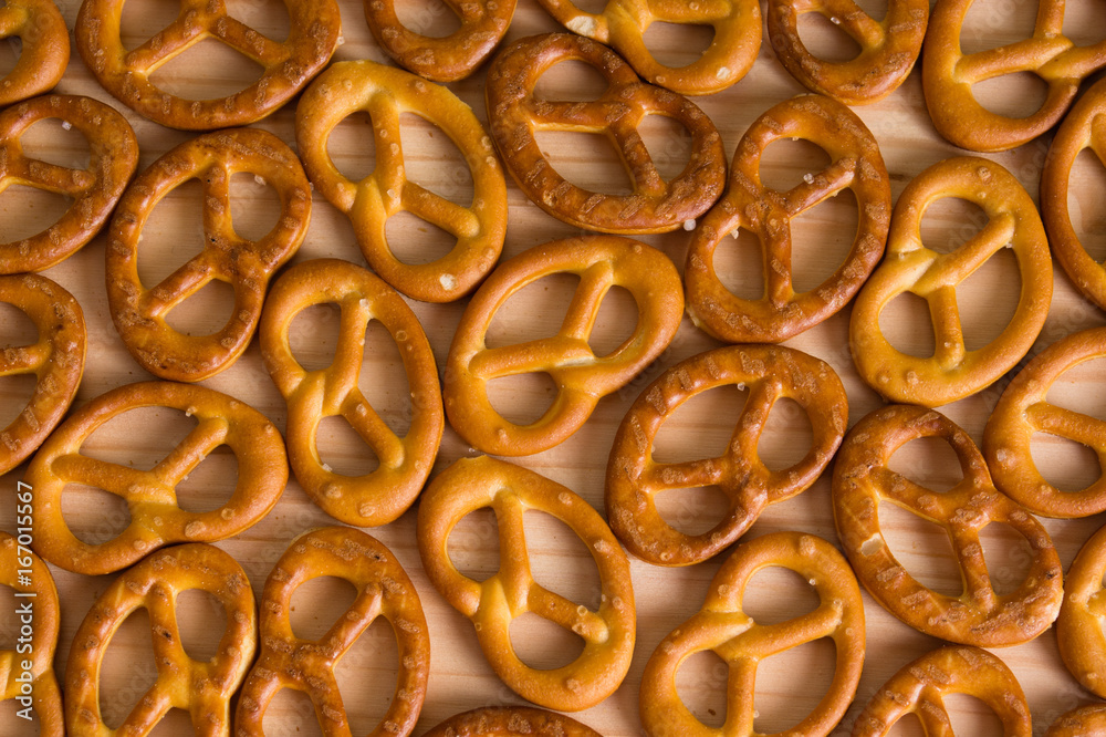 Background texture of salted savory mini pretzels in the traditional ...