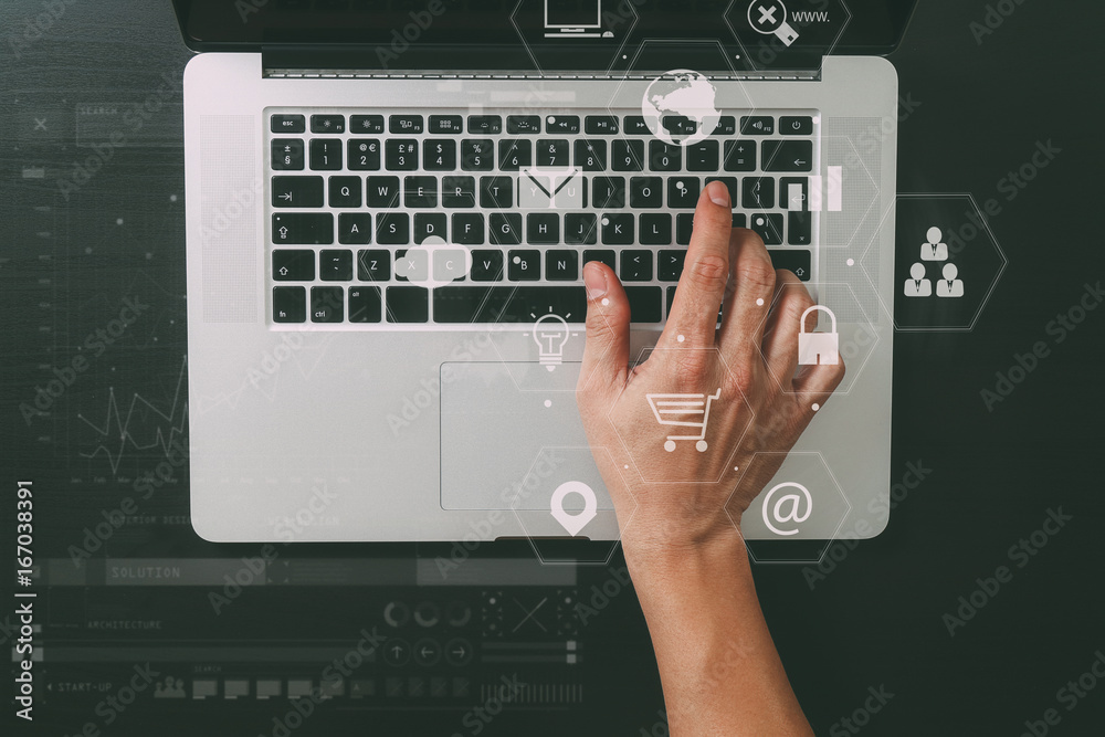 top view of businessman typing keyboard with laptop computer on wooden ...