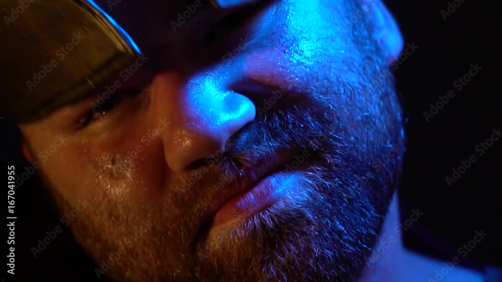 Bald Roman gladiator with a beard and scar in his face puts off a ...