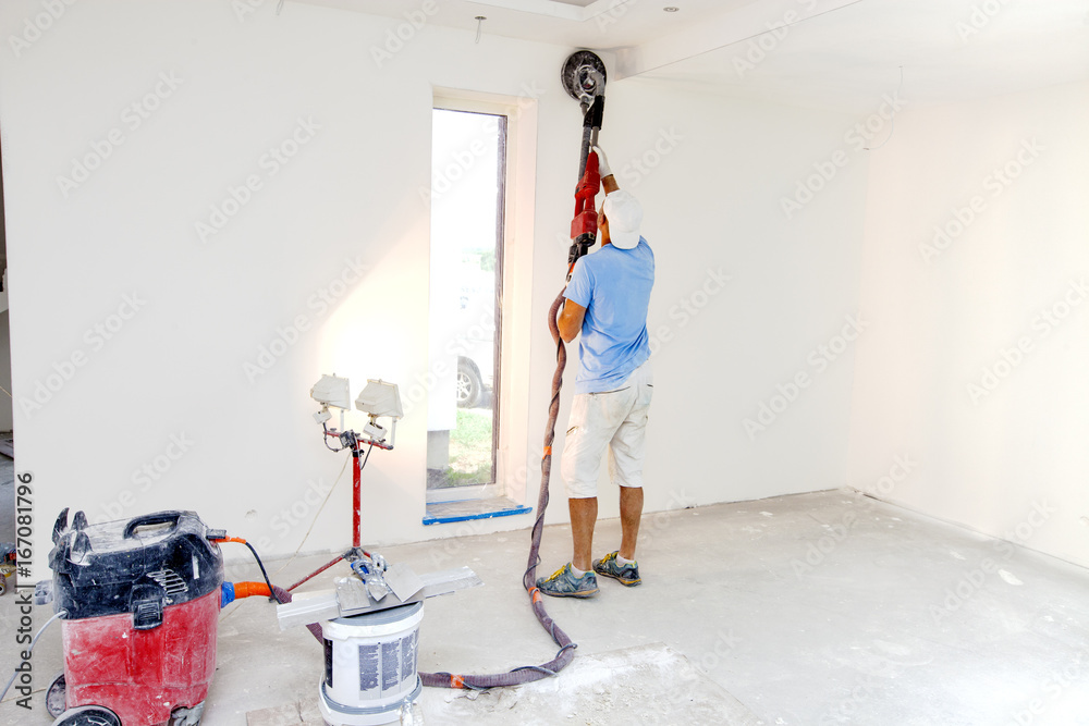 Drywall sanding. Drywall sanders, drywall sanding tool. worker using ...