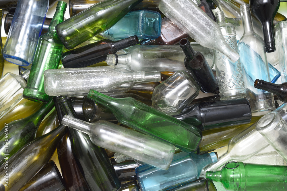 Glass bottles inside a glass recycling container Stock Photo | Adobe Stock
