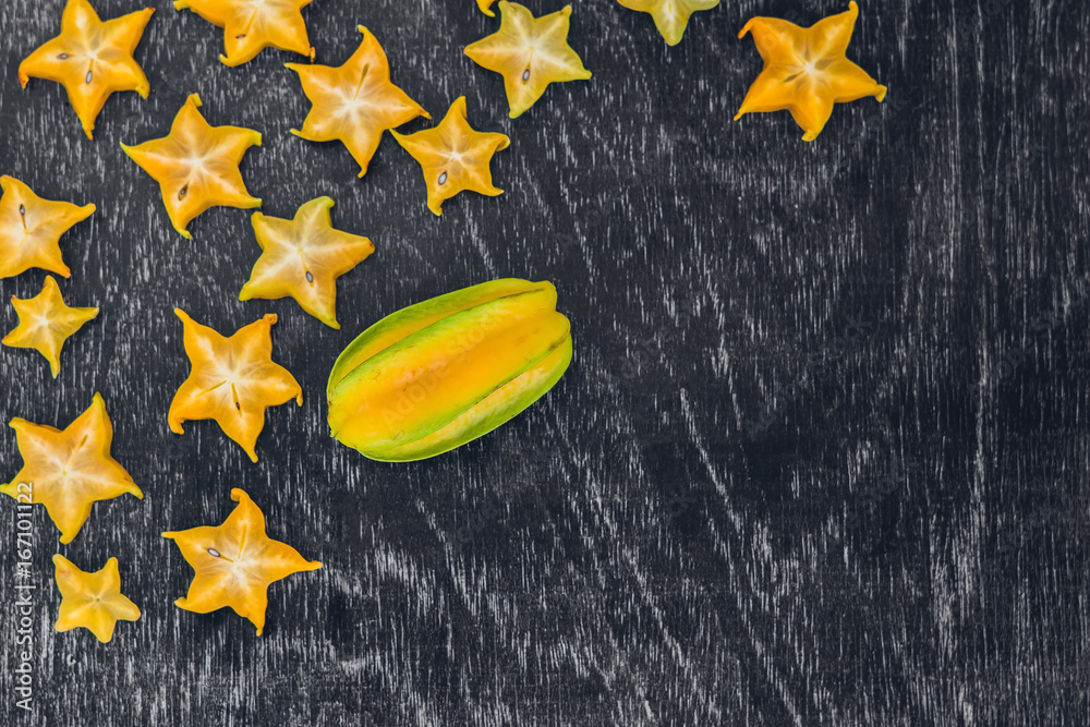 Star fruits on wooden table. Thai fruit : Star fruit is popular in asia ...