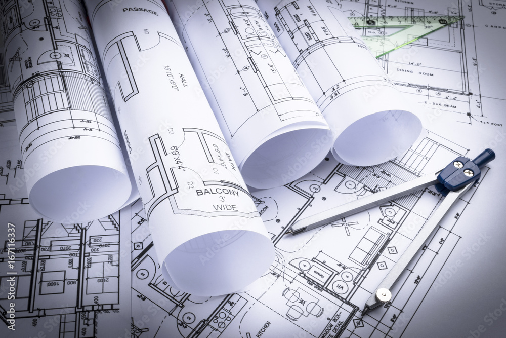 Architectural blueprints and blueprint rolls and a drawing instruments ...