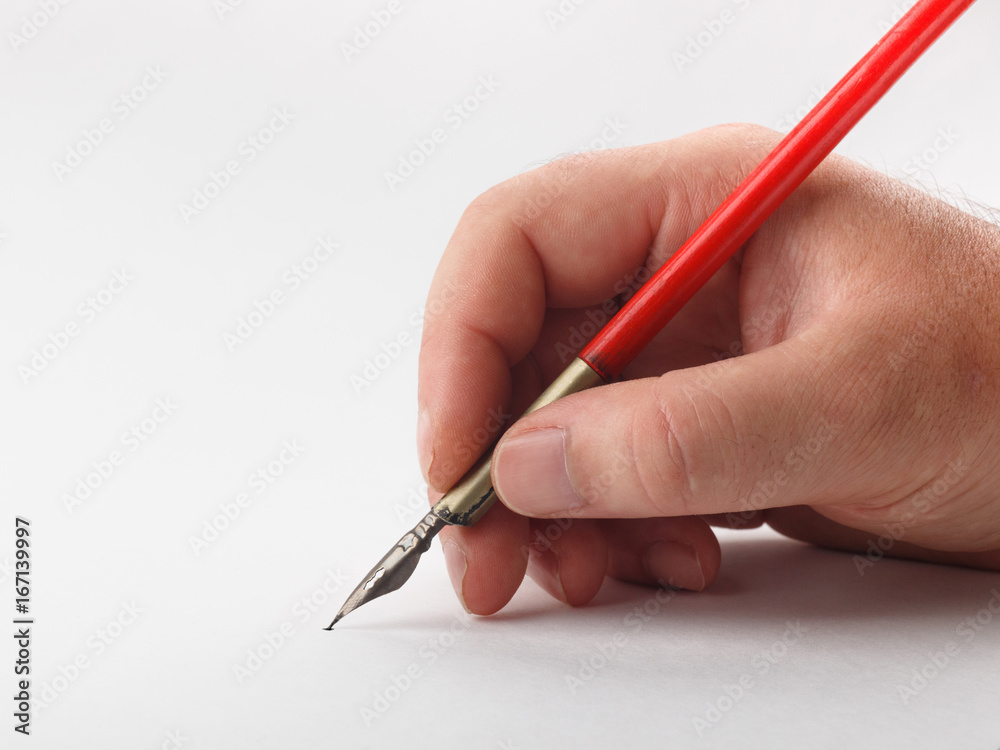 hand holding old inkpen on white paper background Stock Photo | Adobe Stock