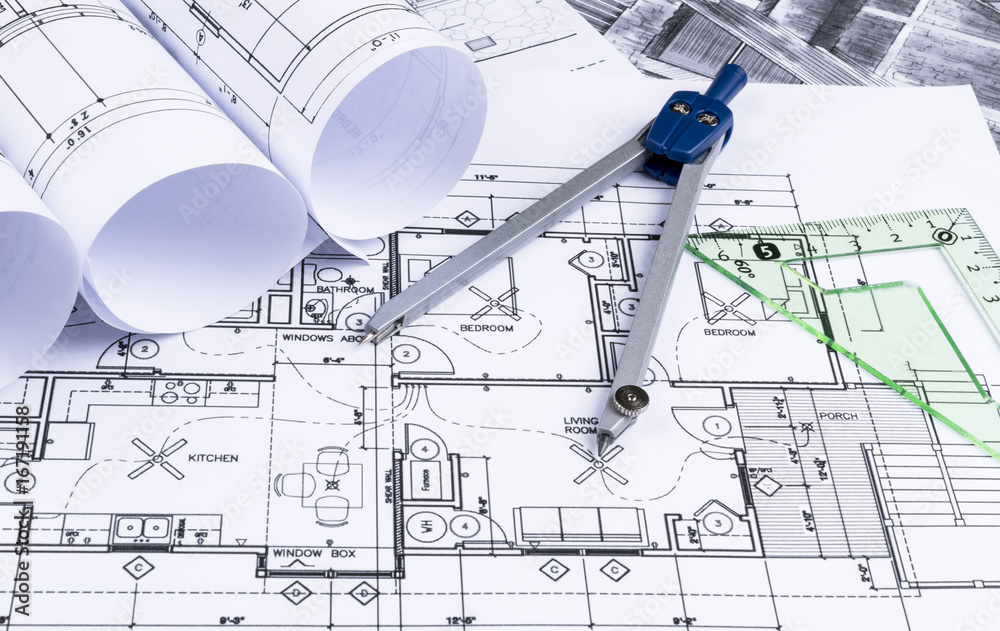 Architectural blueprints and blueprint rolls and a drawing instruments ...