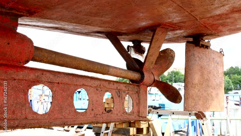 Lower part of ship rusty metal at shipyard in port of Moscow. Process ...