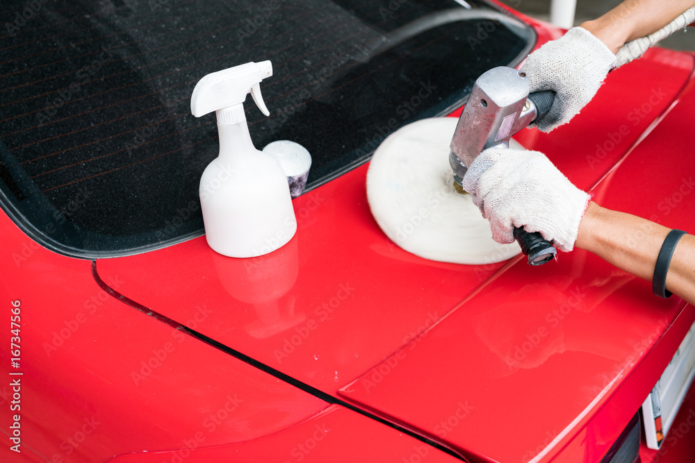 Red Car surface buffing. Renewing using polish machine. Polish ...