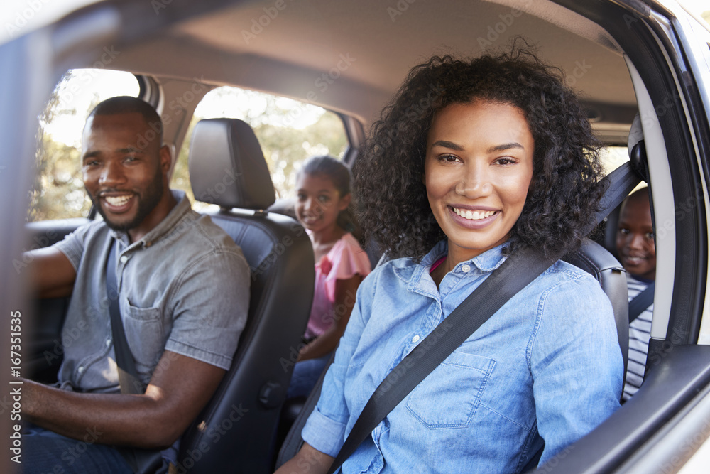 Young black family in a car on a road trip smiling to camera Stock ...