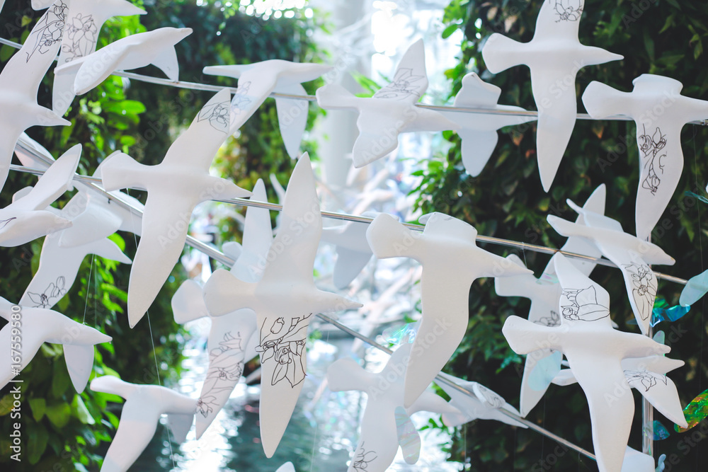 White birds flying mode decoration outdoor background at Siam Paragon ...