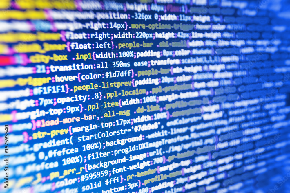 Big data and Internet of things trend. Software source code. Programmer typing new lines of HTML ...