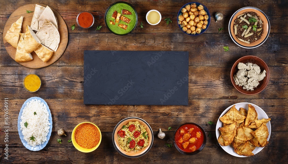 Assorted indian food on a wooden background. Dishes and appetizers of ...