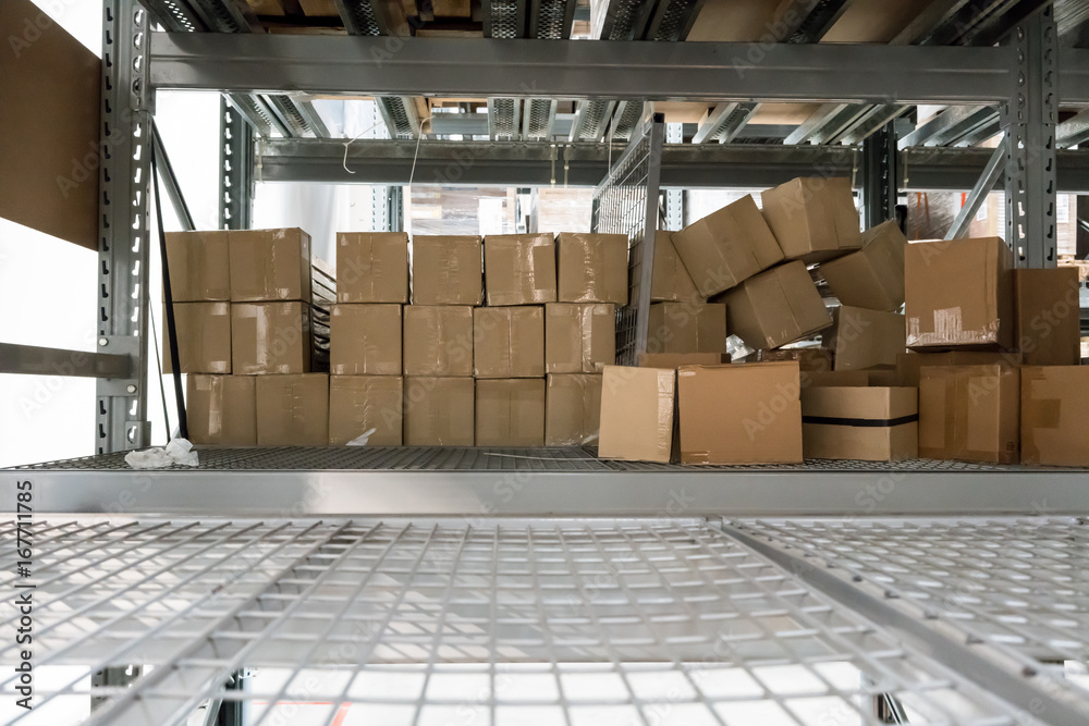 Abandoned carton boxes on steel racks Stock Photo | Adobe Stock
