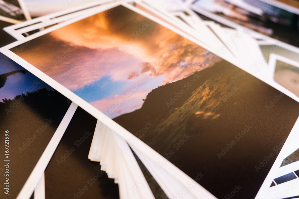 Printed photos on table Stock Photo | Adobe Stock
