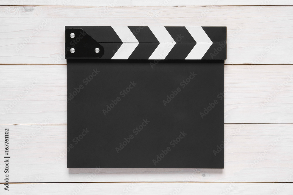 blank black clapper board on top view vintage white wood table for the ...