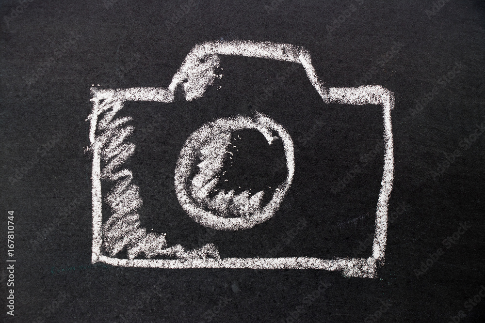 White chalk hand drawing as camera icon on black board background Stock ...