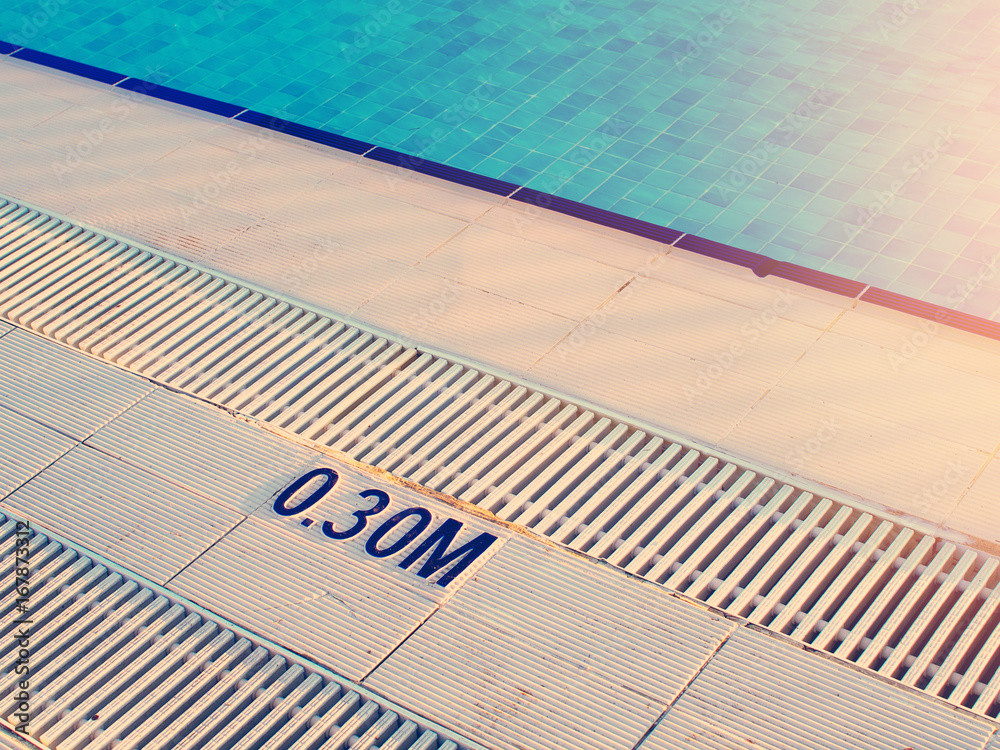 depth marker in kids swimming pool , sunshine toned Stock Photo | Adobe ...