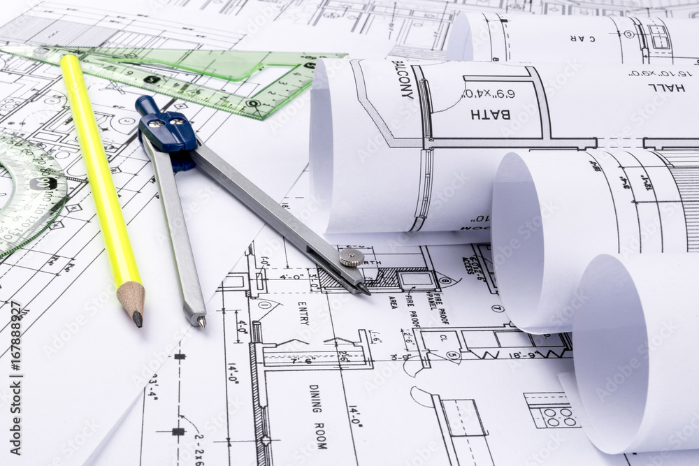 Architectural blueprints and blueprint rolls and a drawing instruments ...
