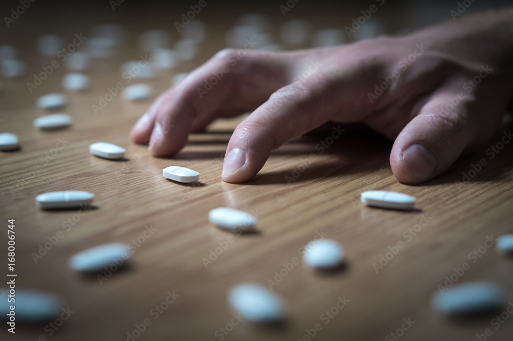 Drug addict with withdrawal symptoms lying on floor. Drug addiction ...