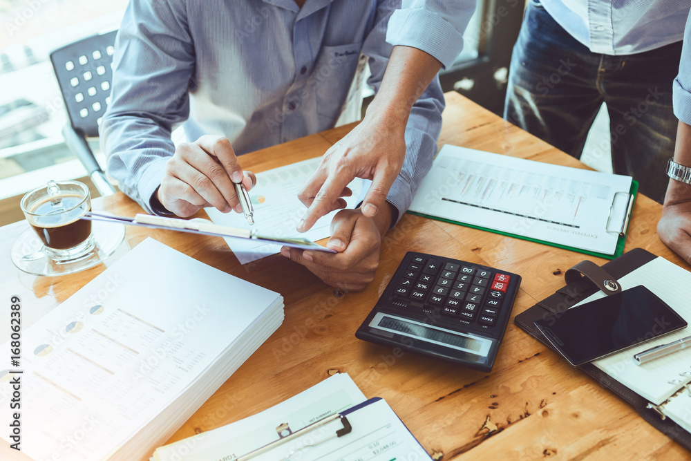 Teamwork business officer working hard investing financial reports and ...