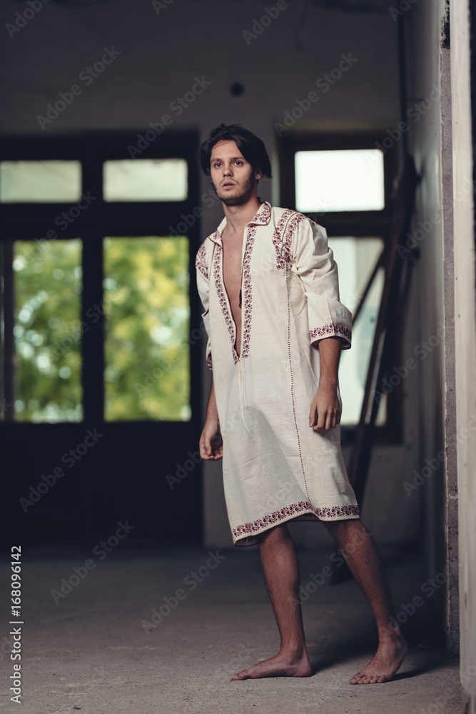 Super male model giving a nice pose for indoor photography. Wearing a ...