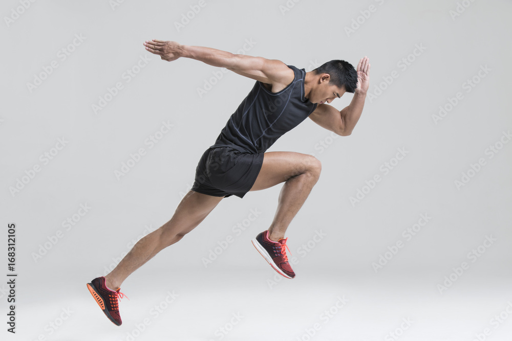Male athlete running against white background Stock Photo | Adobe Stock