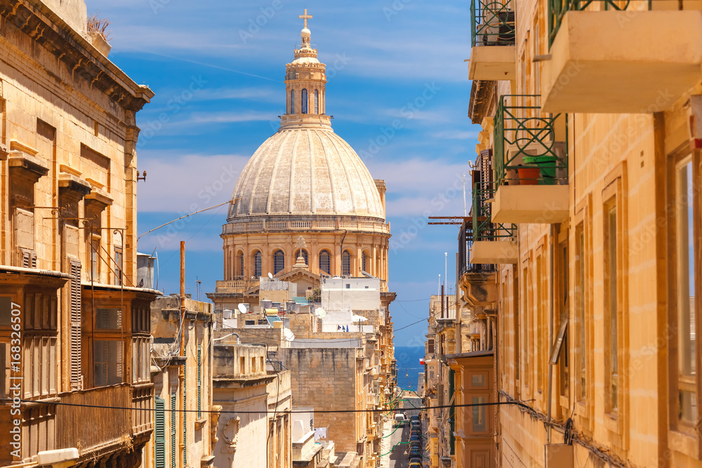 The traditional Maltese colorful wooden balconies and Our Lady of Mount ...