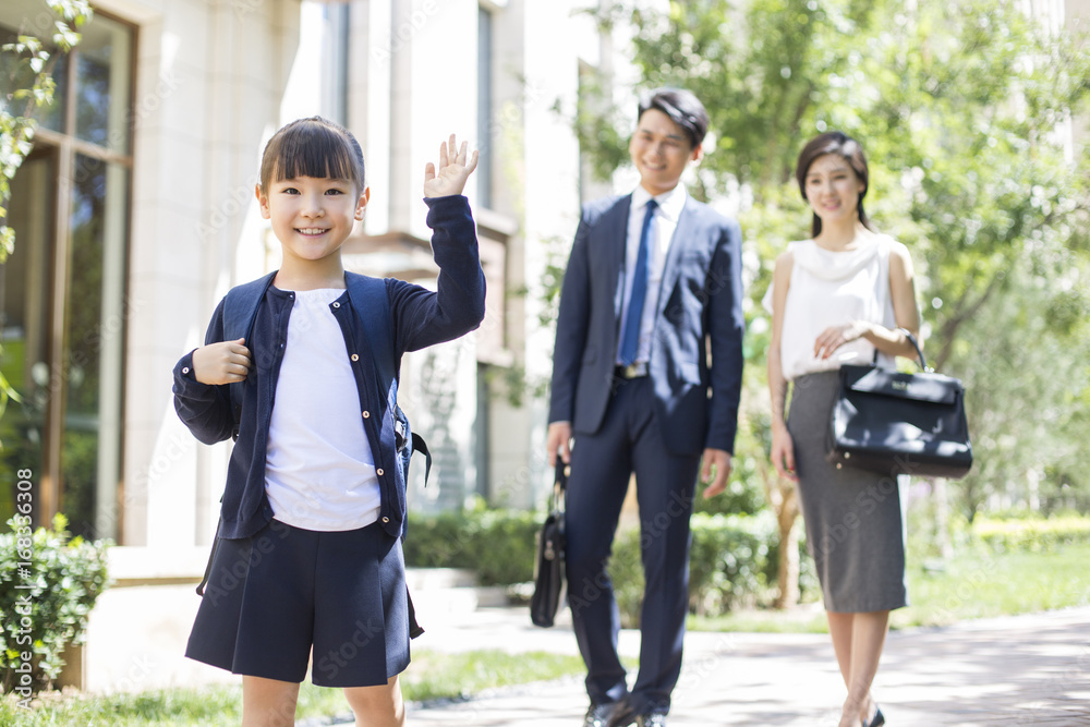 Parents taking their child to school in the morning Stock Photo | Adobe ...