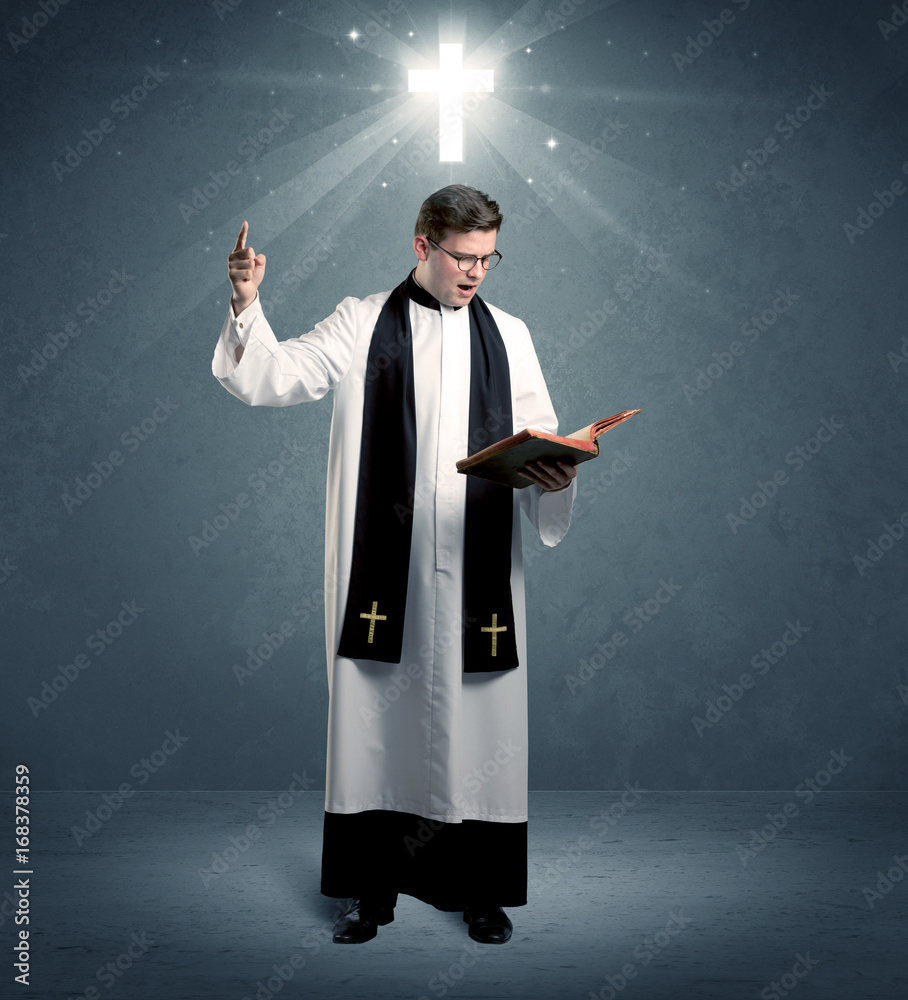 young priest in giving his blessing Stock Photo | Adobe Stock