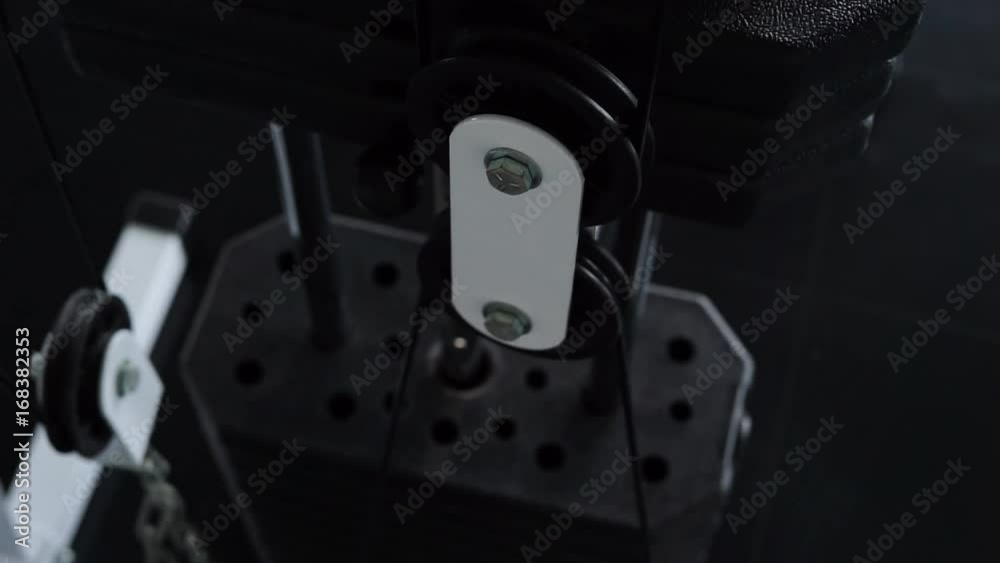 plates weighs stack moves, lifts, rises and pulls up in fitness gym ...