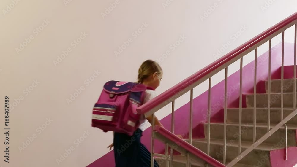 Schoolgirl go upstairs staircase school home. Back to school. Go home ...