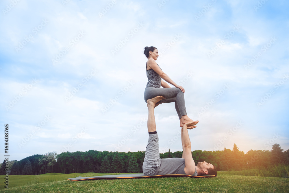 People practice acro yoga outdoors healthy lifestyle Stock Photo ...