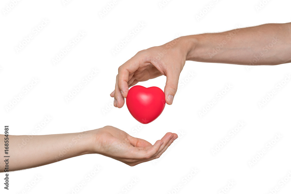 Heart transplant and organ donation concept. Hand is giving red heart ...