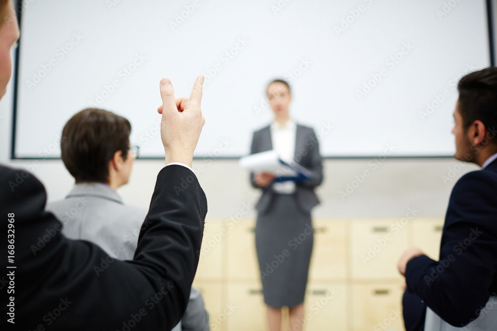 Female speaker taking questions from audience while making presentation ...