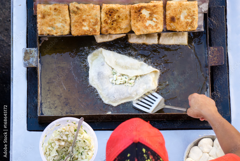 Top view of a man hand cooking vegetables martabak jawa in Kota ...