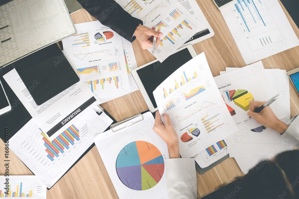 Meeting table/desk top view, businessman talking about business plan ...