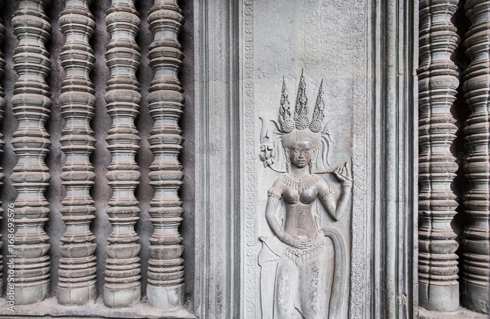 Detail of stone carvings of Apsara is a beautiful and seductive girl of ...