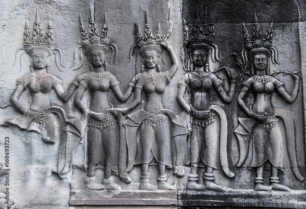 Detail of stone carvings of Apsara is a beautiful and seductive girl of Hindu mythology at ...