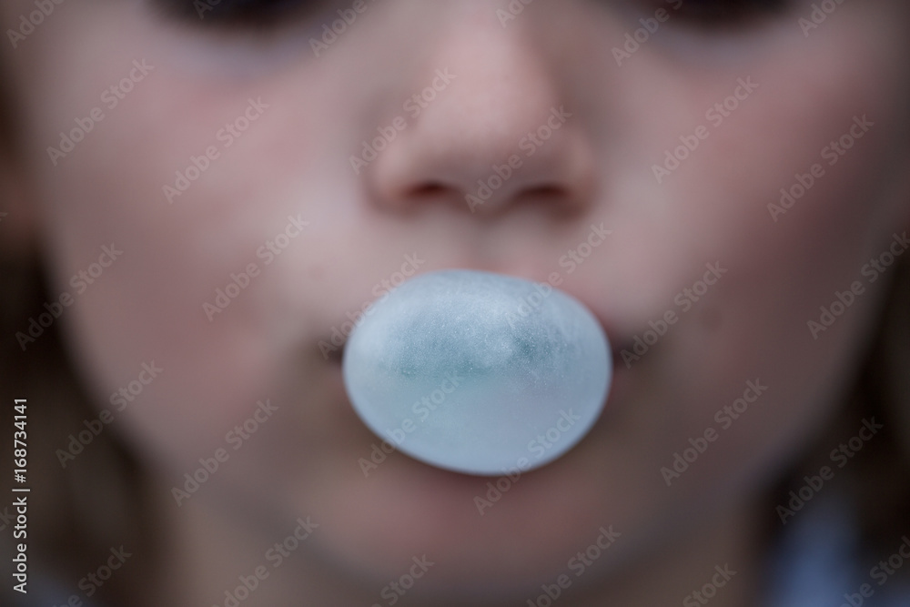 Child Blowing Bubble Gum