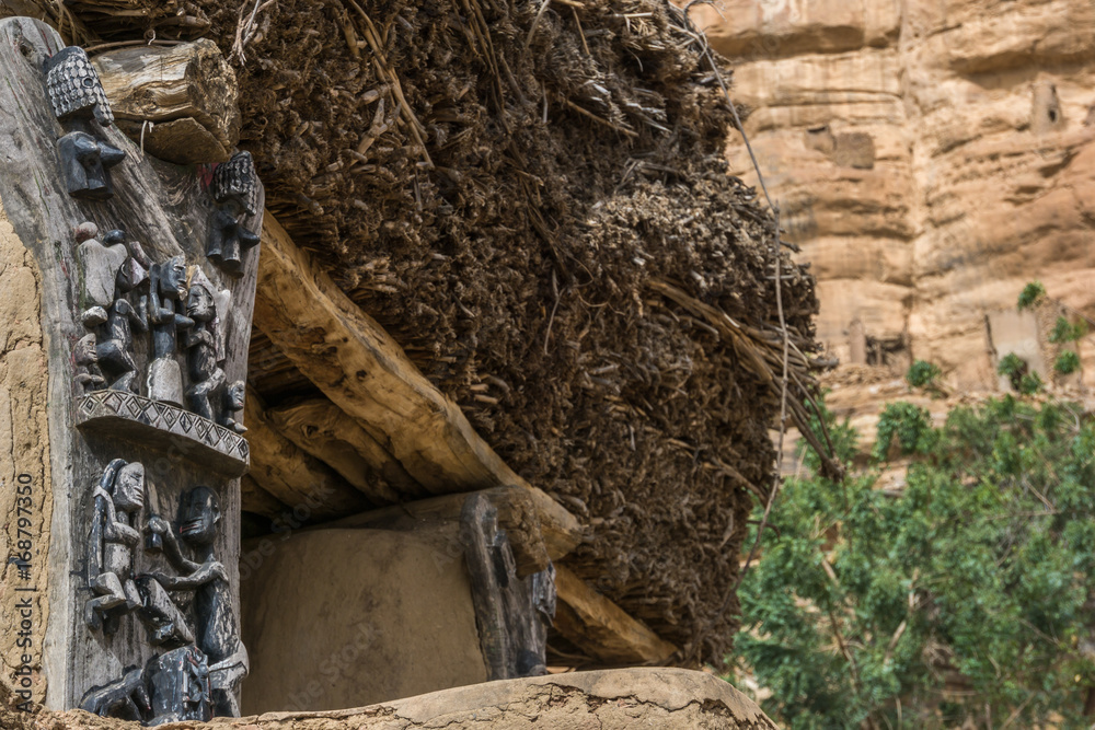 Ancient Dogon village built into the cliff face of the Bandiagara ...