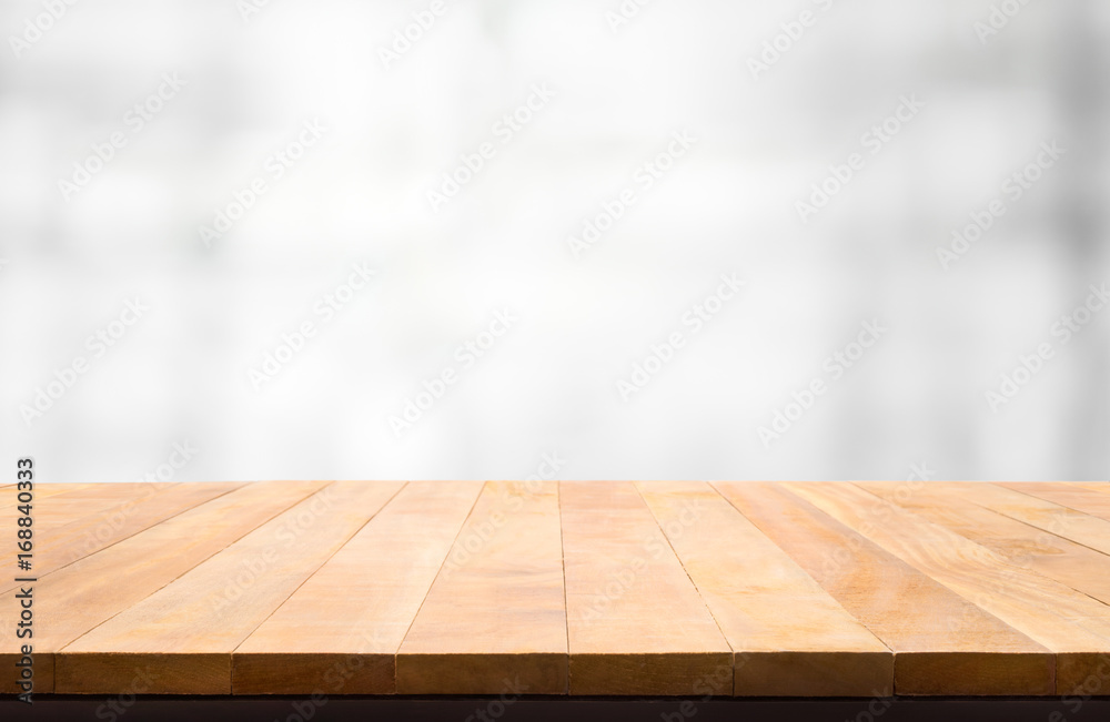 Wood table top on blur white abstract background.For montage product ...