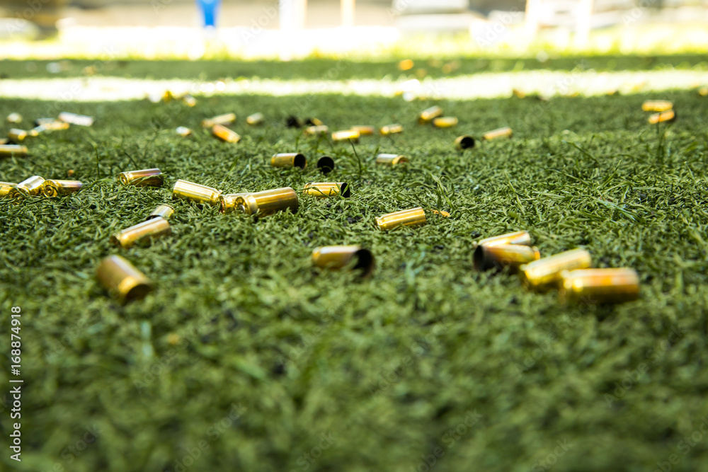 bullet shells ground. Cases of bullets lying on the floor of artificial ...