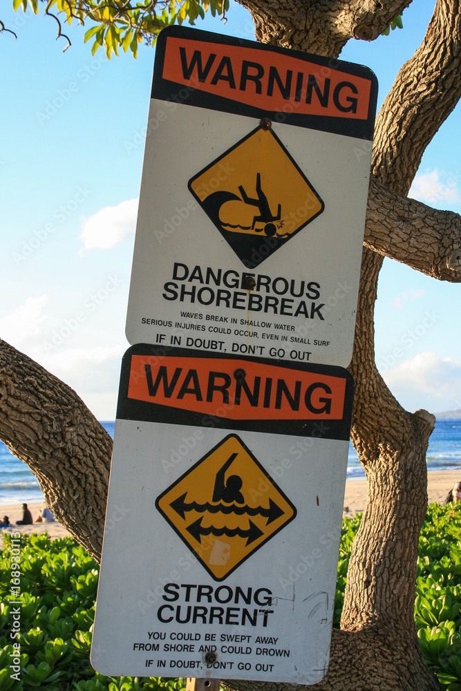 Two warning signs at Hapuna Beach, Hawaii giving information that ...