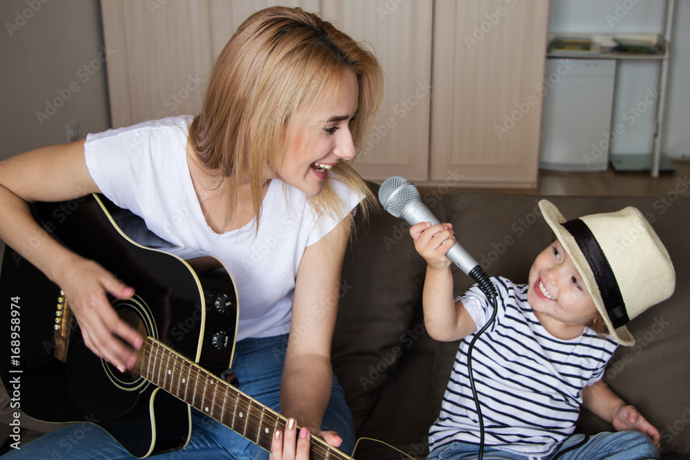 Sisters playing the guitar and singing Stock Photo | Adobe Stock