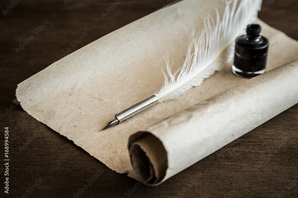 Old quill pen on the old paper. Letter writing. Historical atmosphere ...