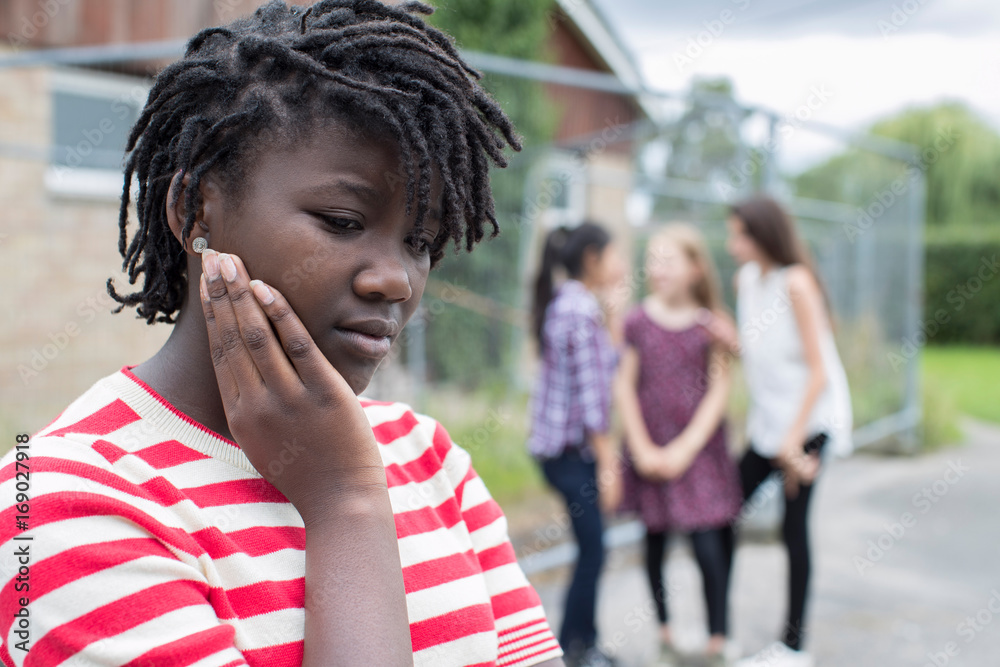 Sad Teenage Girl Feeling Left Out By Friends Stock Photo | Adobe Stock