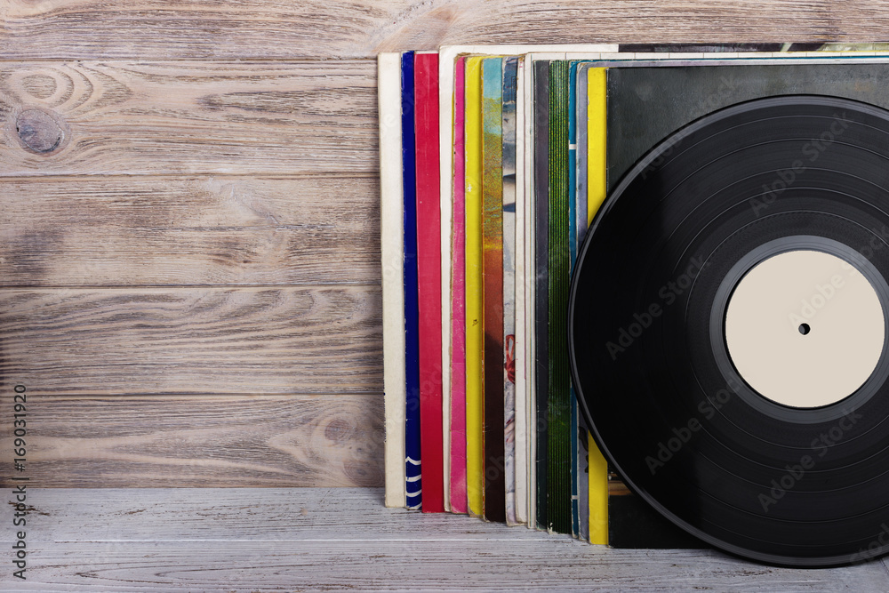 Retro styled image of a collection of old vinyl record lp's with ...