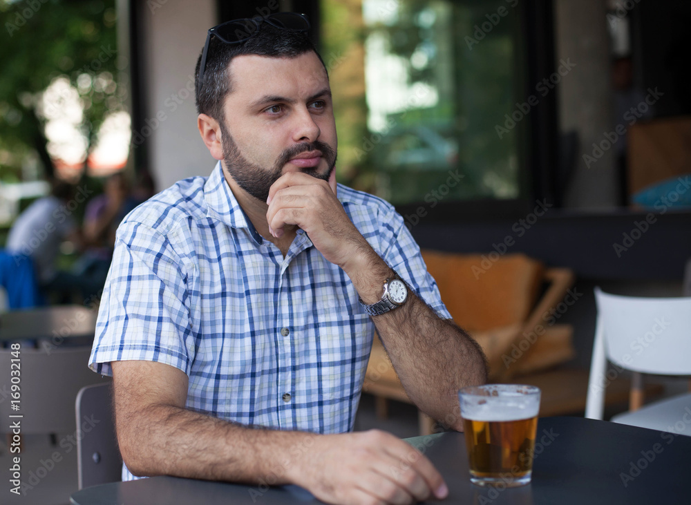 Man sitting in bar Stock Photo | Adobe Stock