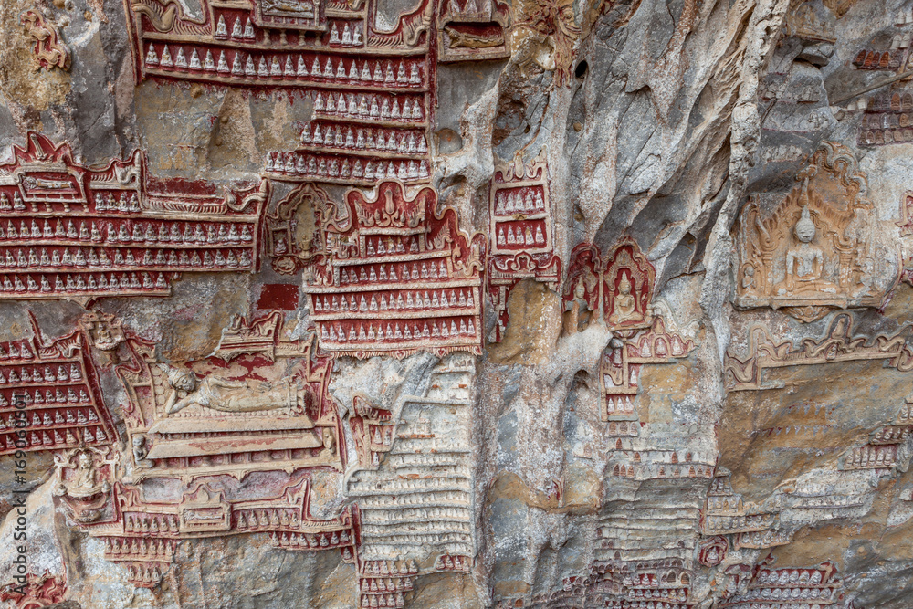 Carvings in Kaw Goon cave background in Myanmar in Myanmar, back. Stock ...